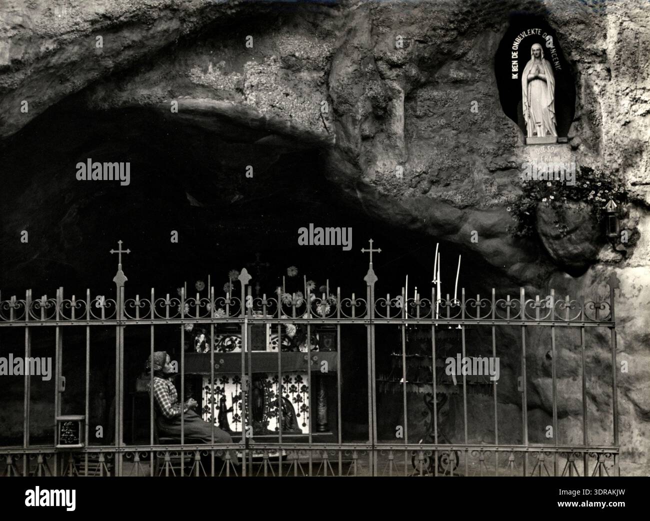 This photograph shows a worshipper praying in a replica of the ...