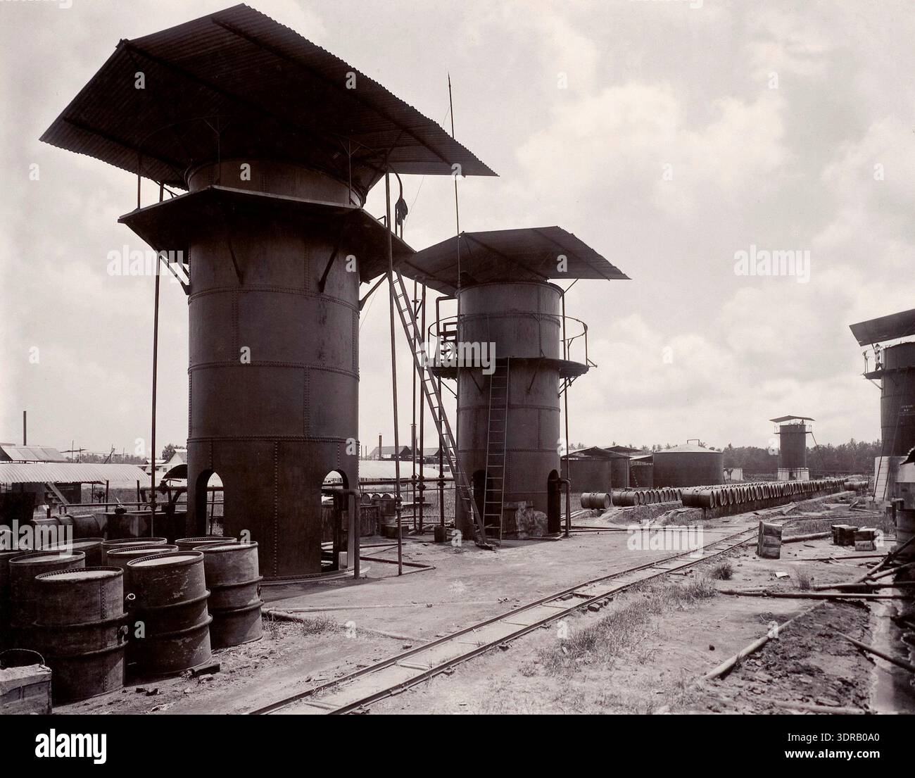 The photograph depicts the dordtsche petroleum maatschappij refinery at ...