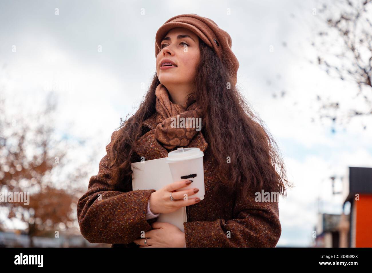 Bottom view of woman finds comfort in reading while seated in the open ...