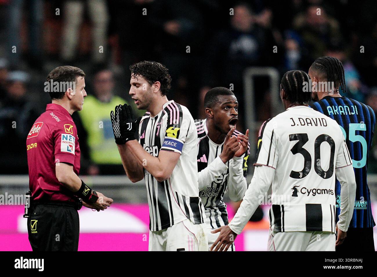 Juventus' Pierre Kalulu reacts after getting a red card during the ...