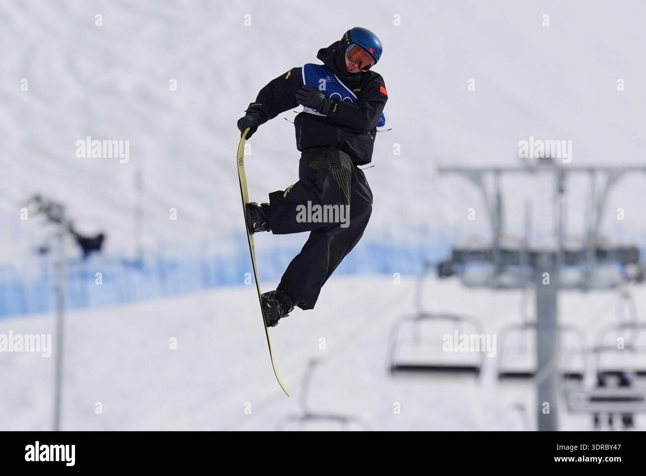 China's Su Yiming competes during the men's snowboarding slopestyle ...