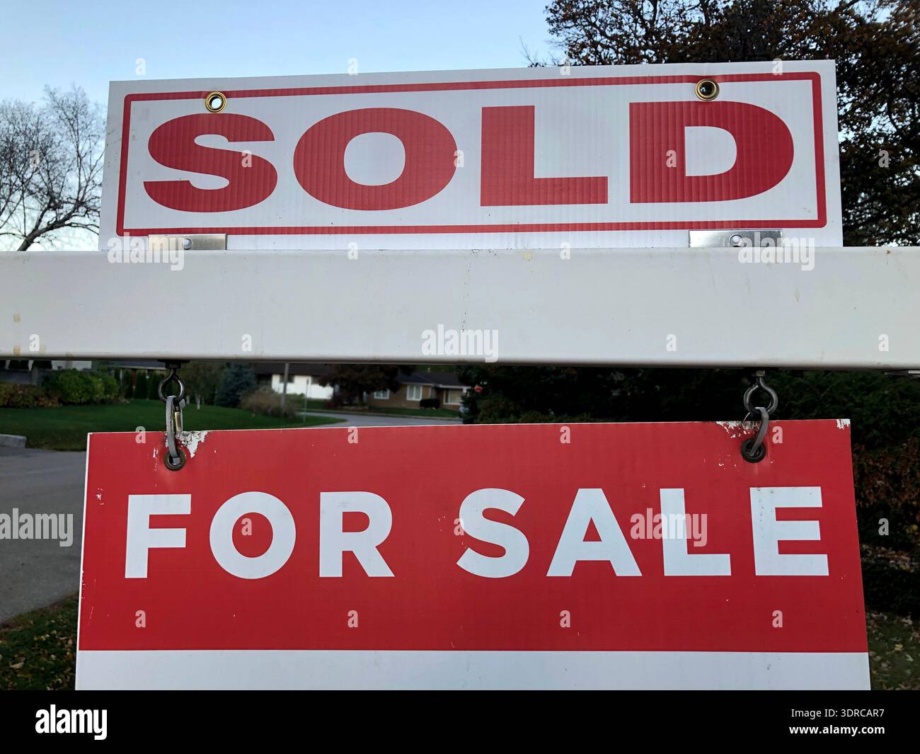 Real estate sale signage is shown on a street in Oakville, Ont., west ...
