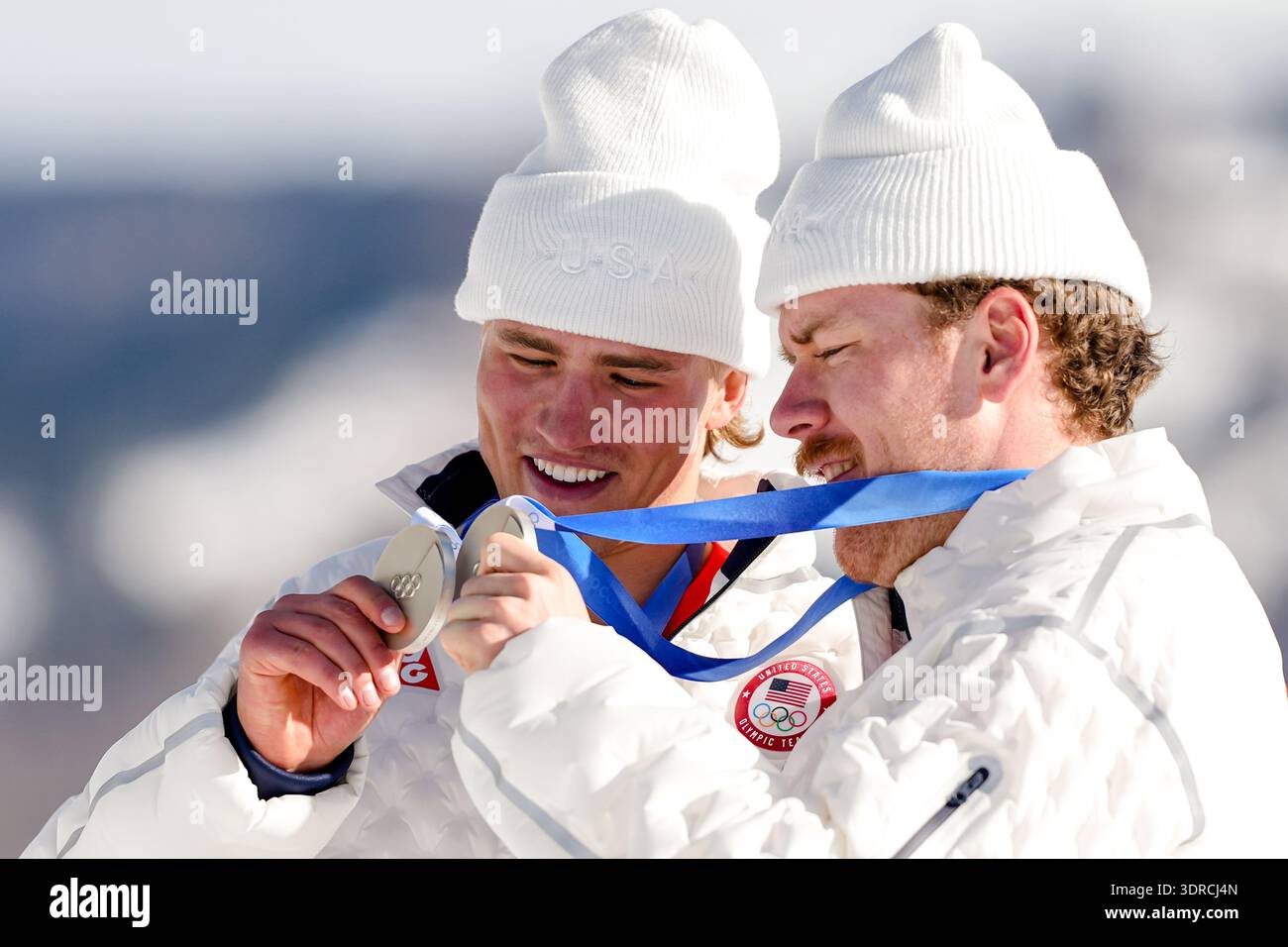 Ben Ogden and Gus Schumacher, of the United States, pose after winning ...