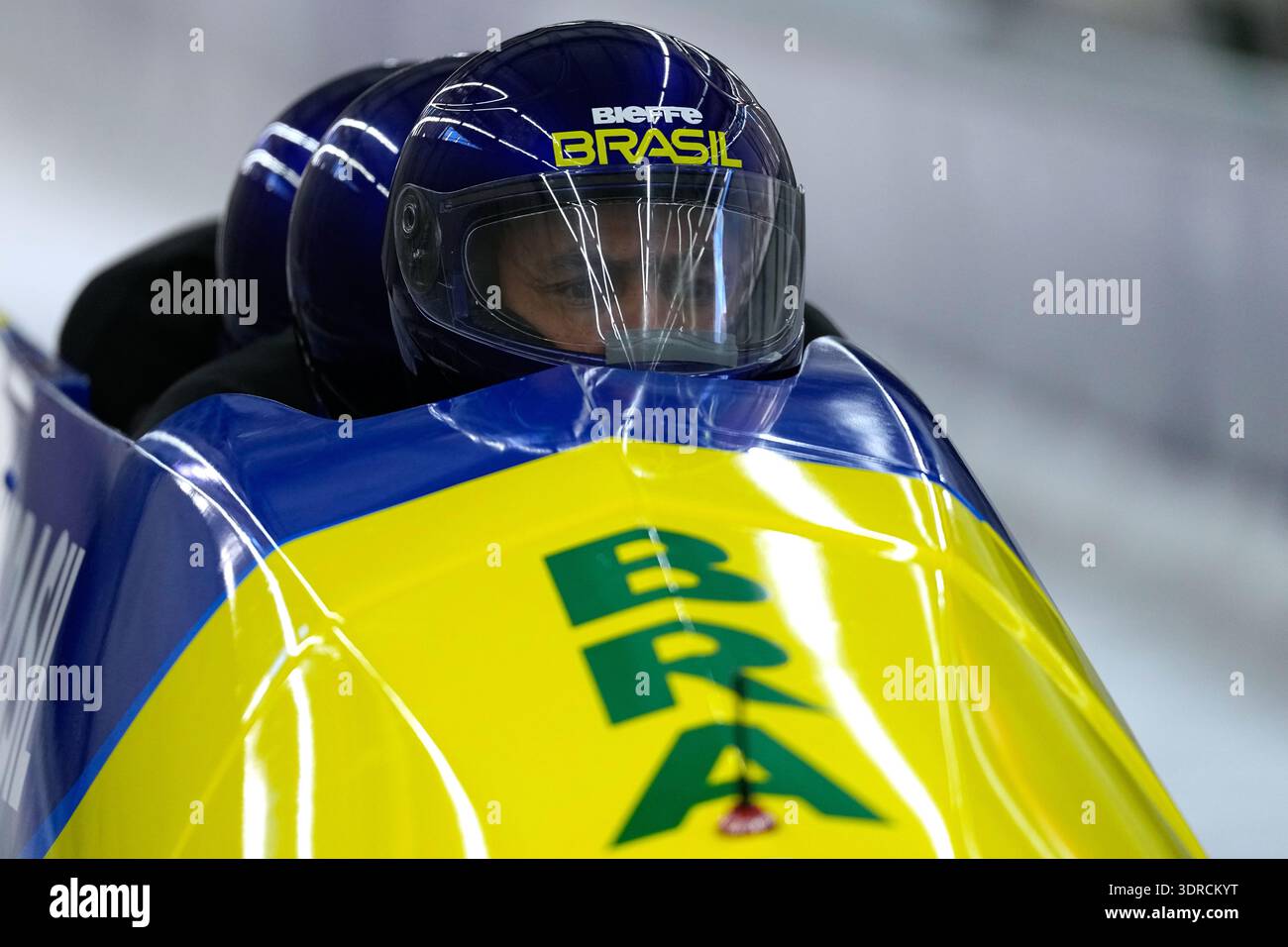 Brazil's Edson Luques Bindilatti, front, starts for a four man bobsled ...