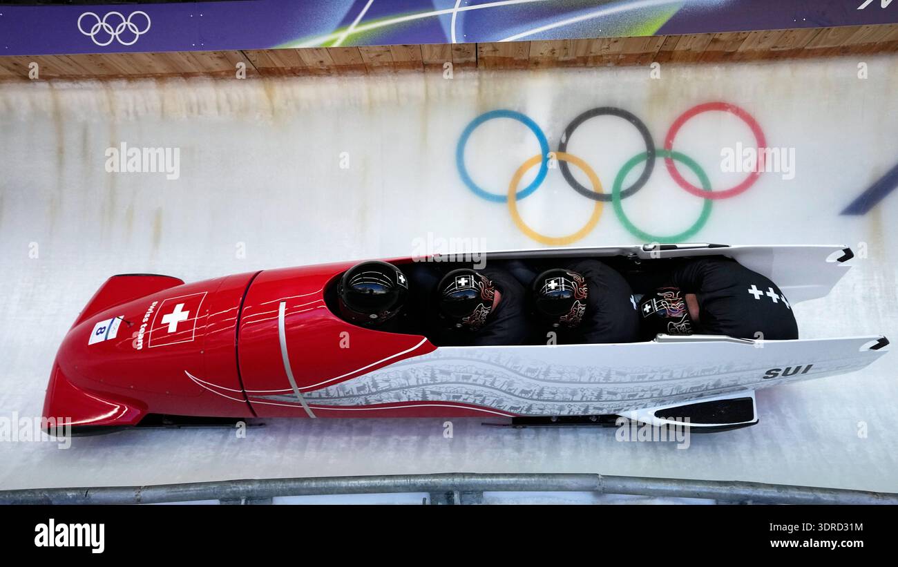 Switzerland's Timo Rohner, left, starts for a four man bobsled training ...