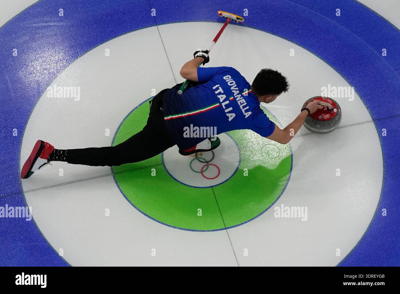 Mattia Giovanella of Italy competes during the men's curling round ...