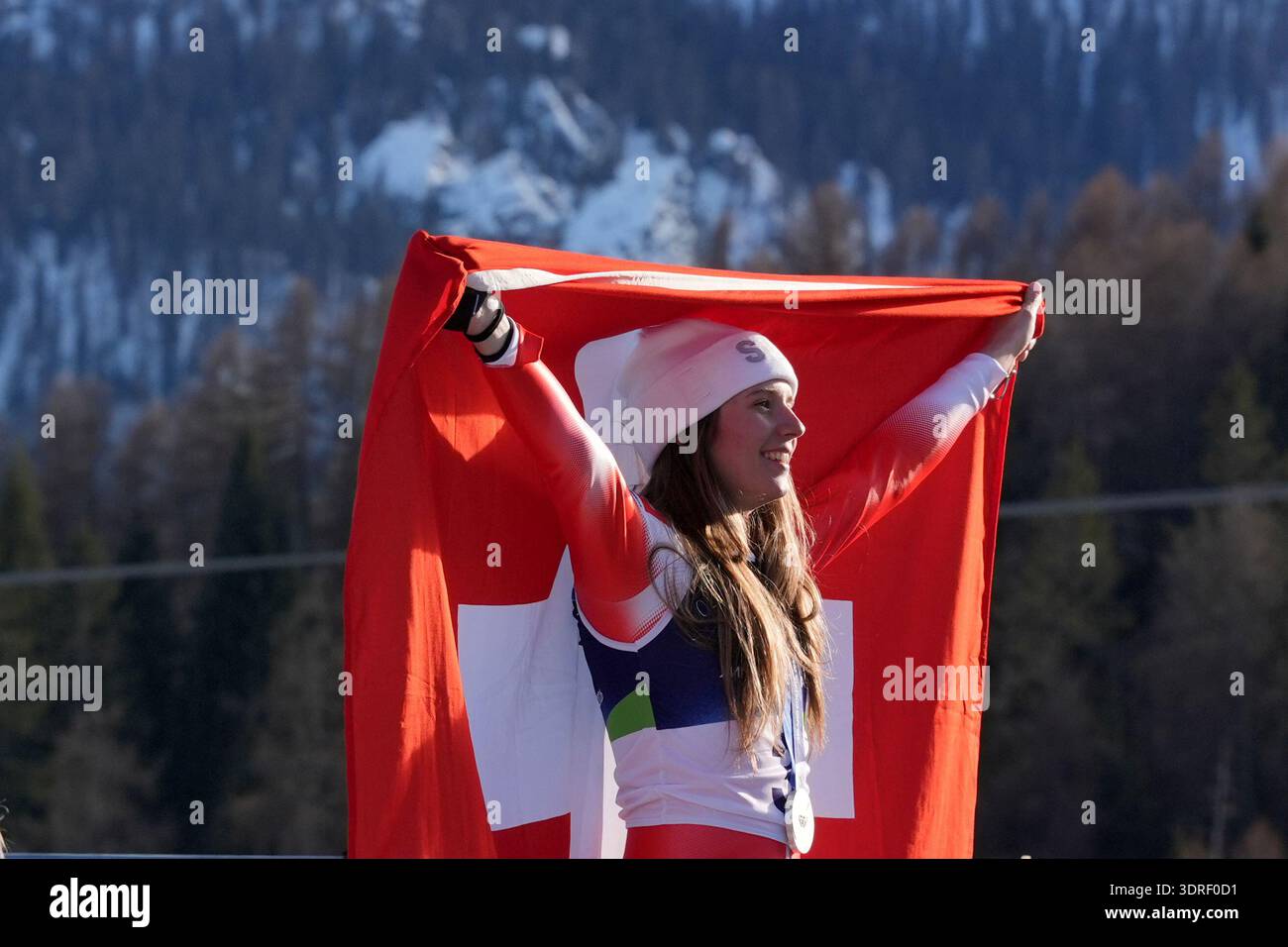Switzerland's Camille Rast bites her silver medal in an alpine ski ...