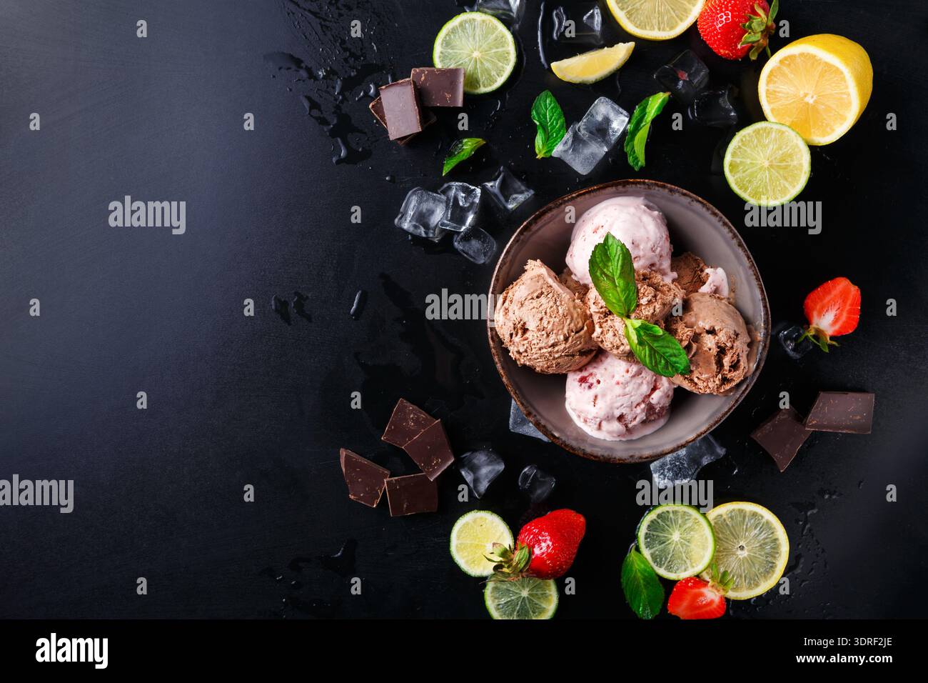 Three Types of Ice Cream With Fruits and Chocolate on a Black Surface ...