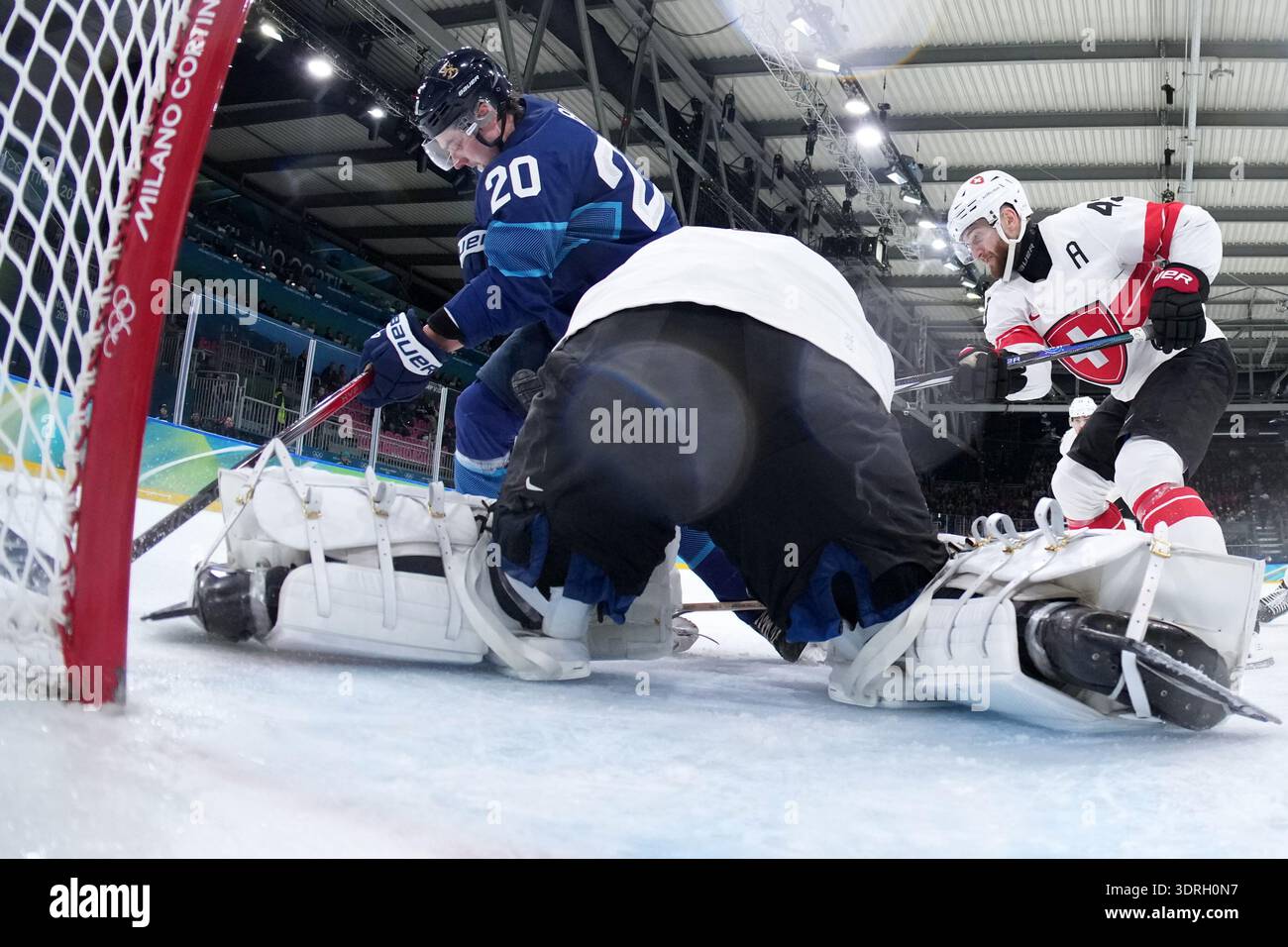 Finland's Sebastian Aho (20) is challenged by Switzerland's Andrea ...