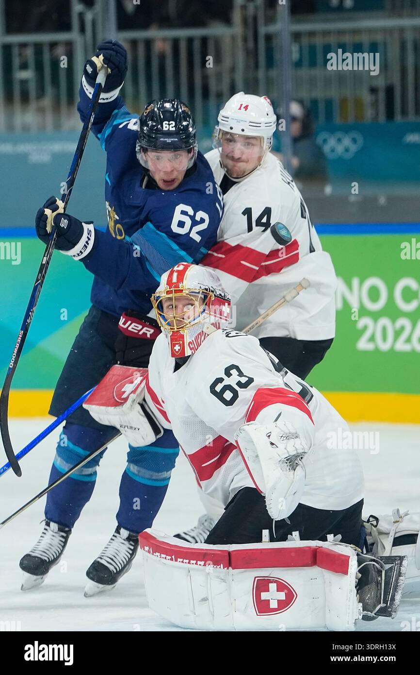 Switzerland's Leonardo Genoni (63) eyes the puck during a men's ice ...