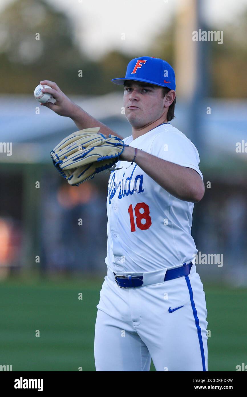 Florida pitcher Cooper Moss (18) warms up before an NCAA baseball game ...