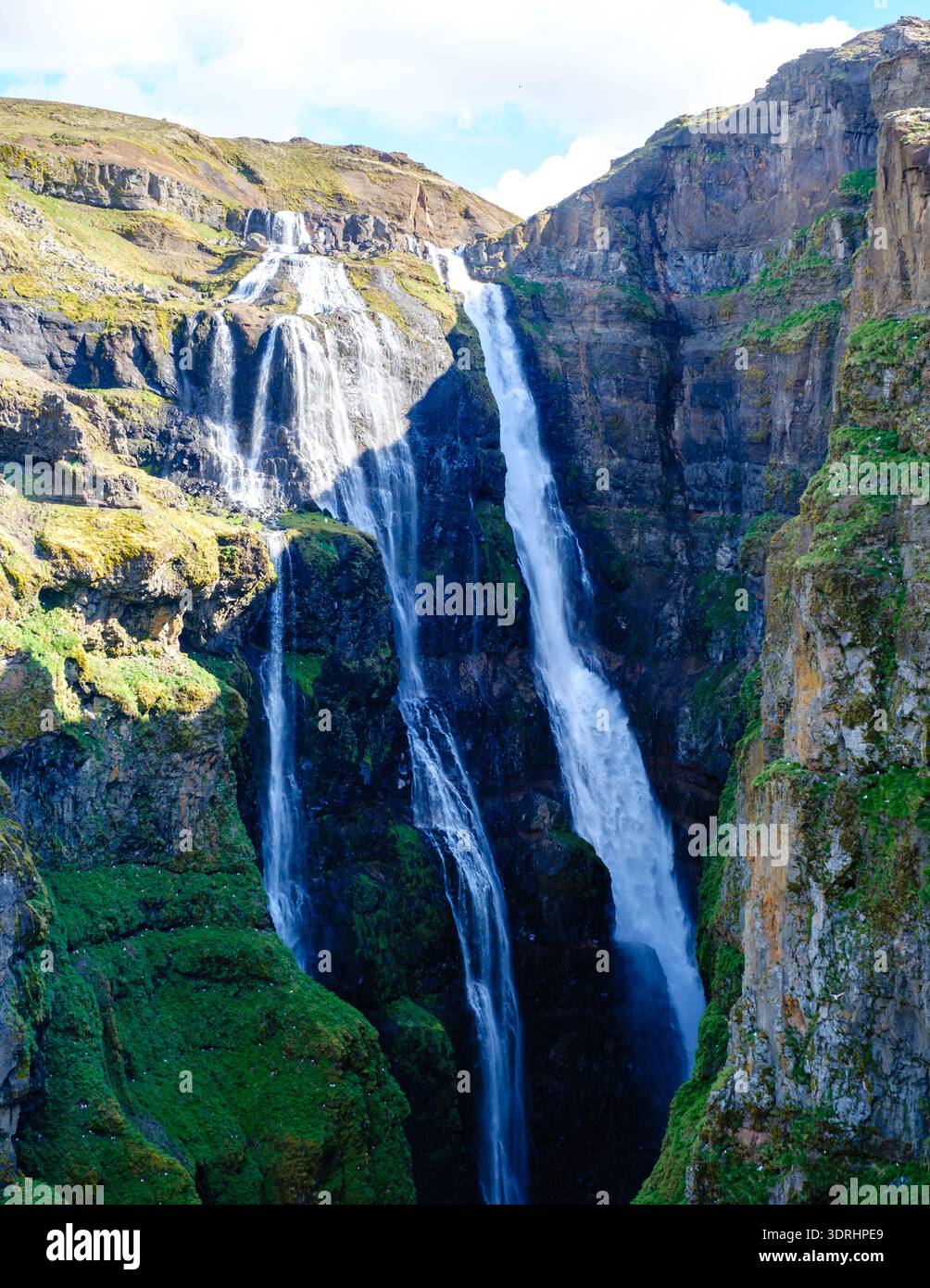 Explore breathtaking glymur waterfall surrounded hi-res stock ...