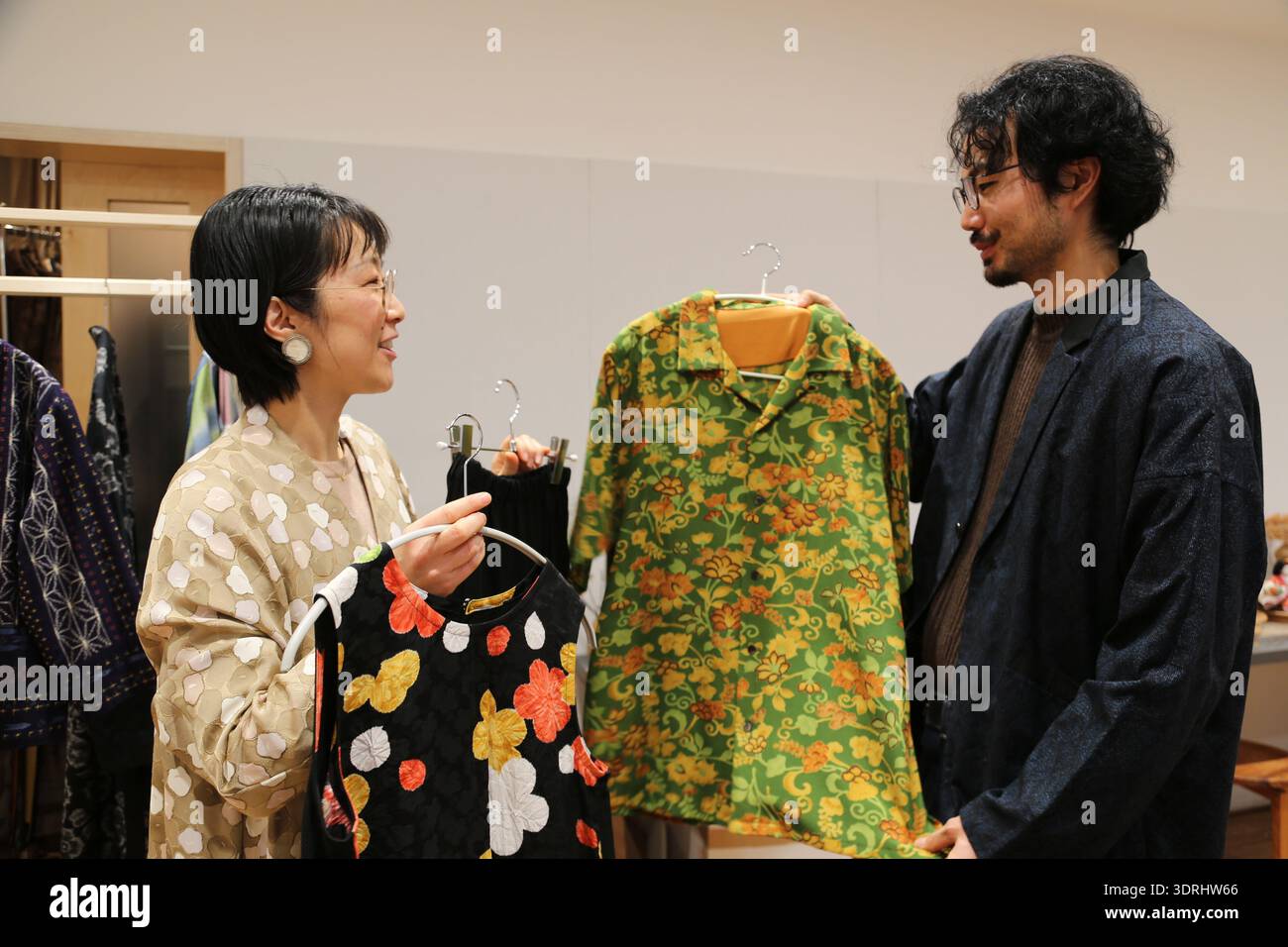 Designer Tomoko Ohkata, left, and her assistant Koki Unami hold Ohkata ...