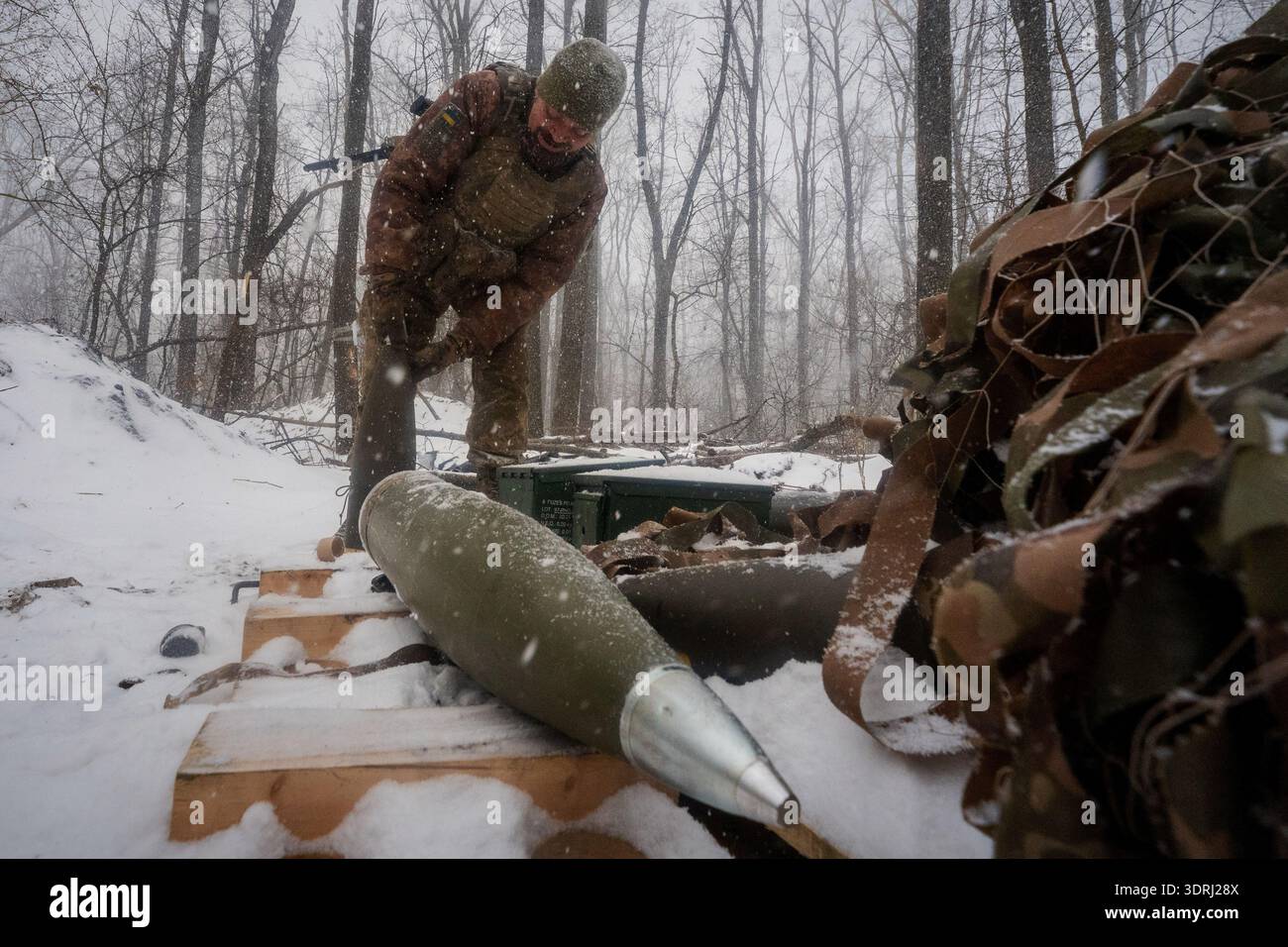 A Ukrainian serviceman of the 48th separate artillery brigade prepares ...