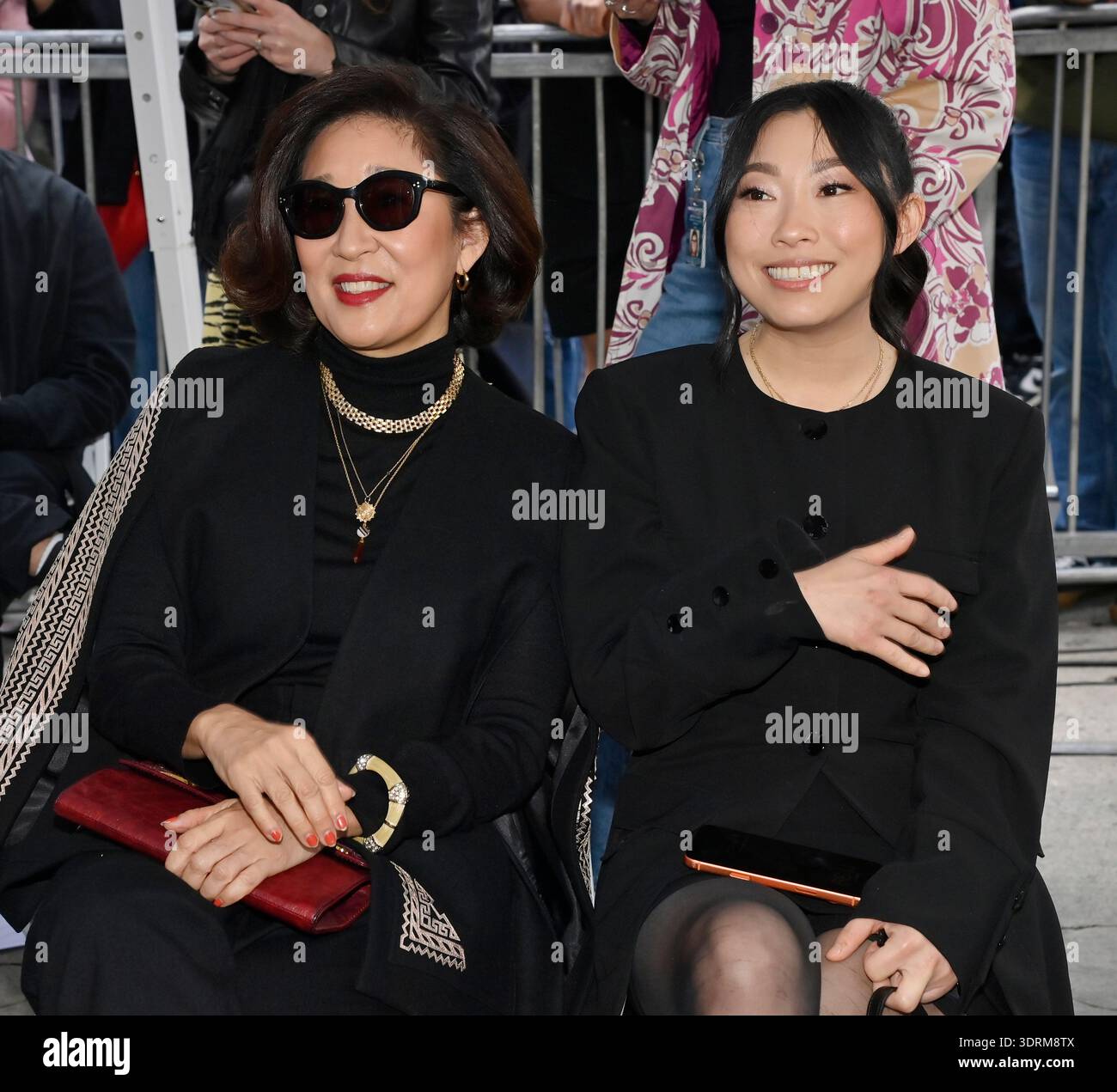 Actresses Sandra Oh (L) and Awkwafina attend an unveiling ceremony ...
