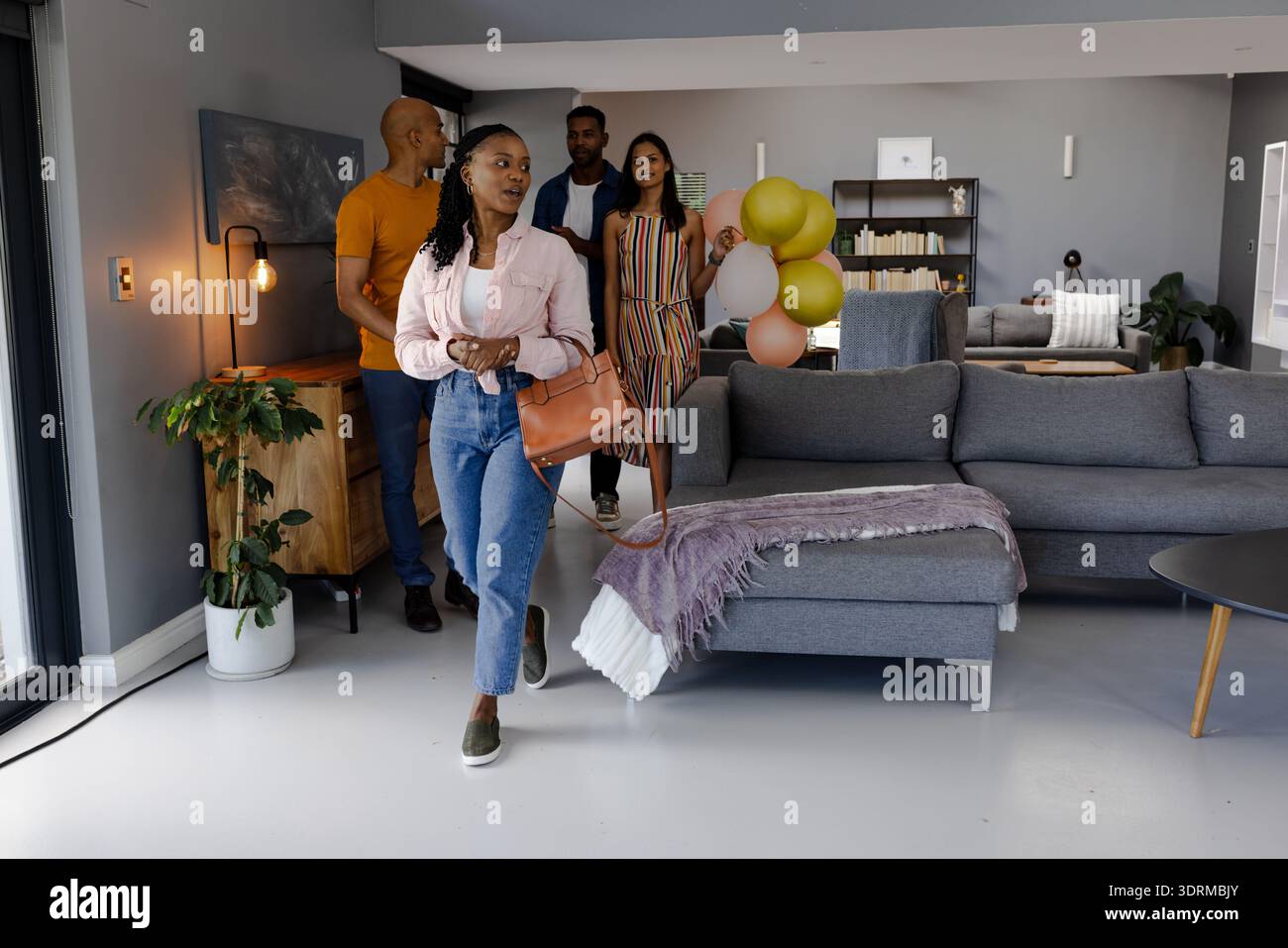 Friends entering modern living hi-res stock photography and images - Alamy