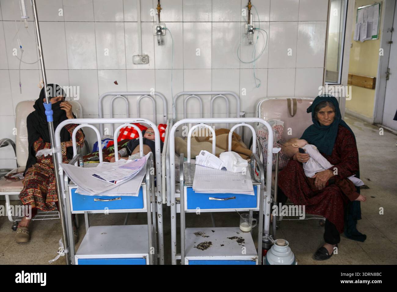 Afghan women care for their children in the malnutrition ward at Indira ...