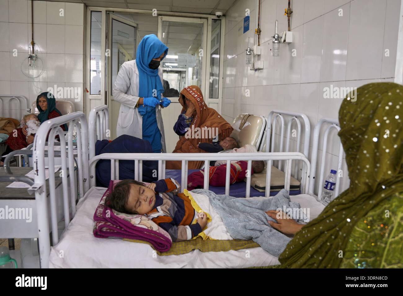 Afghan women care for their children in the malnutrition ward at Indira ...