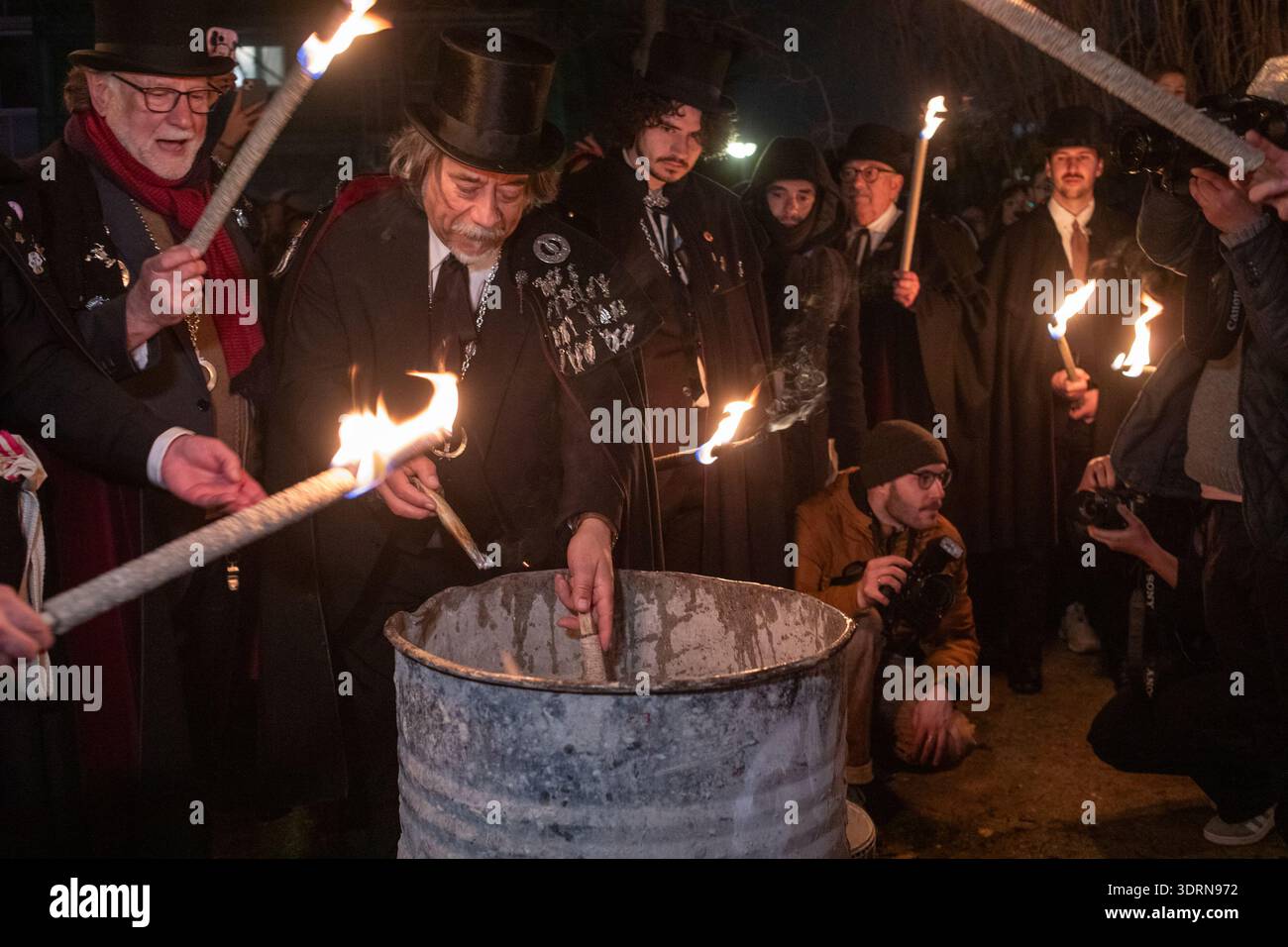 Members of the Merry Brotherhood of the Burial of the Sardine carry ...