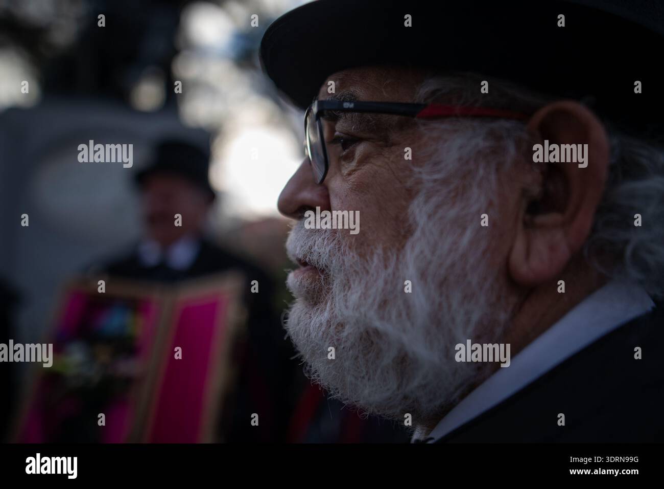 A member of the Merry Brotherhood of the Burial of the Sardine is seen ...