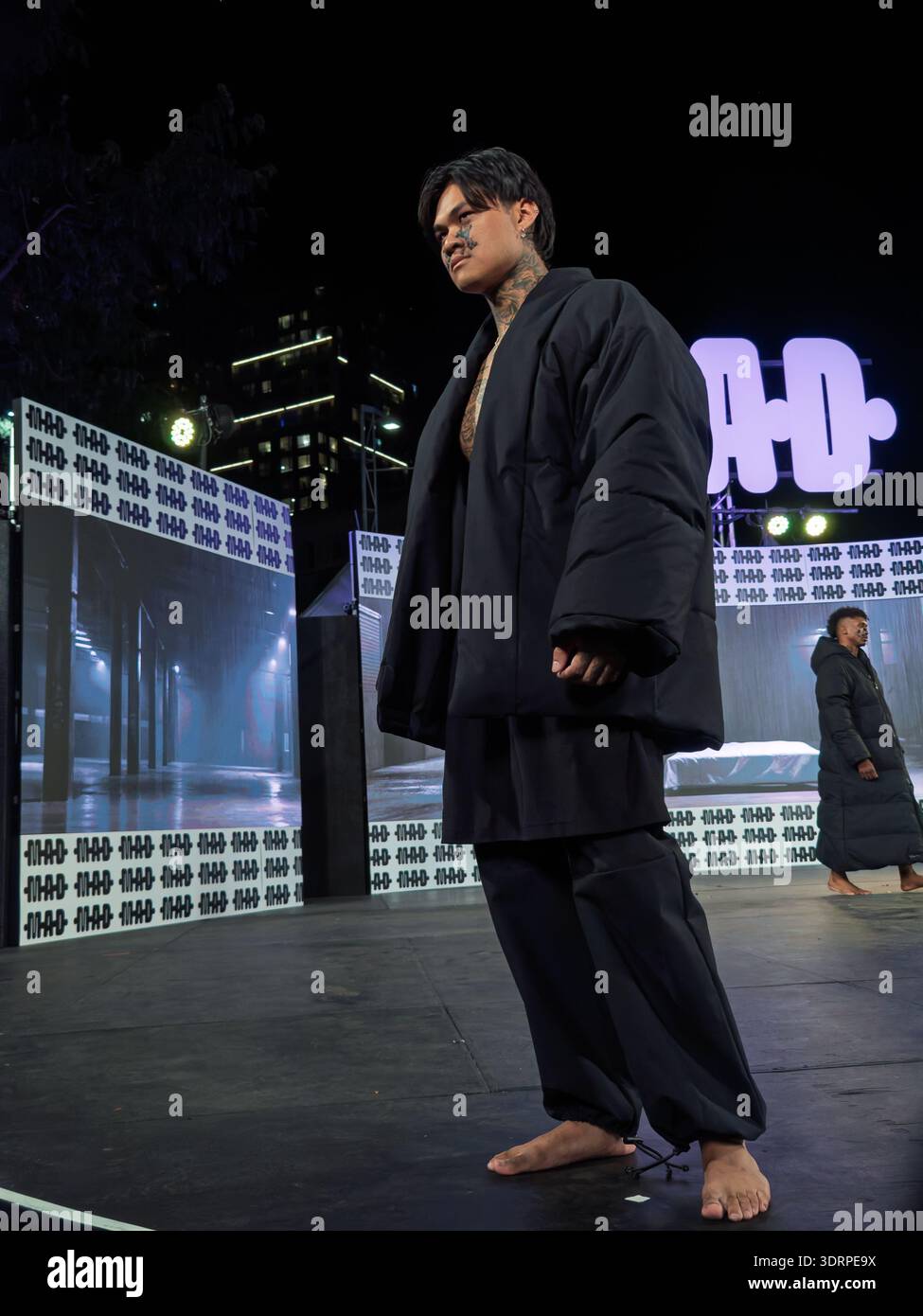 A male model pose on the runway at the Guillaume Chaigne fashion show ...