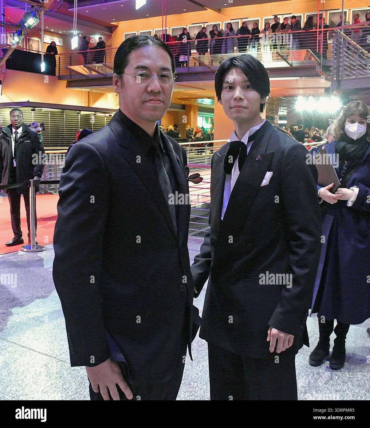 Japanese film director Yoshitoshi Shinomiya (L) poses for a photo with ...