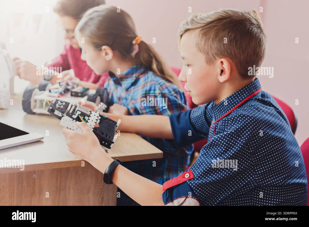 Children build robots during hi-res stock photography and images - Alamy