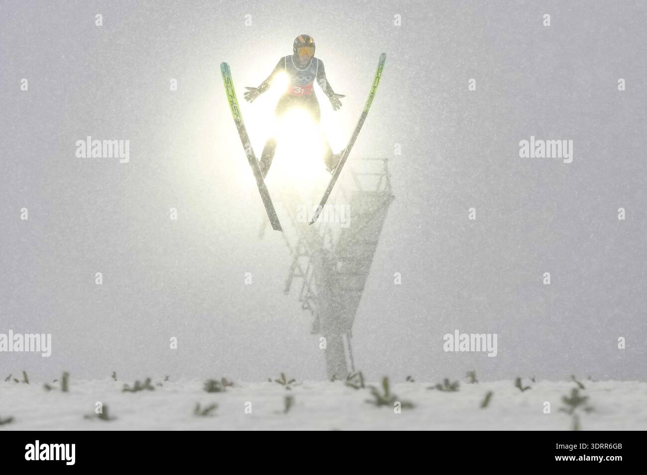 Zhao Zihe, of China, soars through the air during his competition round ...