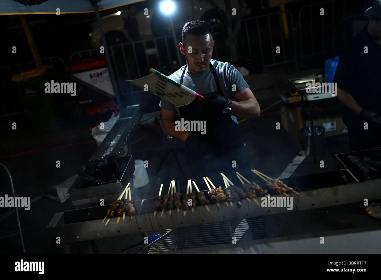 Ali Hassanzada is seen at work at his stall at the Dandenong night ...