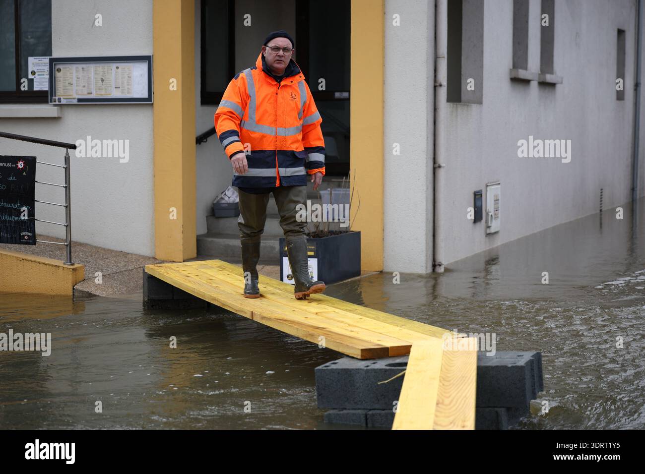 Inhabitant pictured during flooding of the Maine River at the mouth of ...