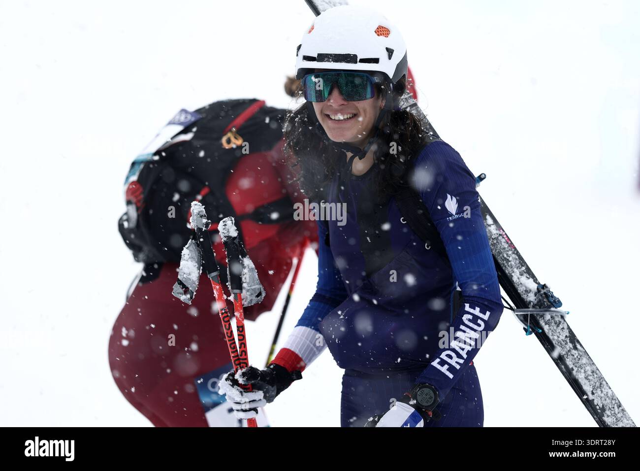 France's Margot Ravinel smiles at the finish area of a ski ...