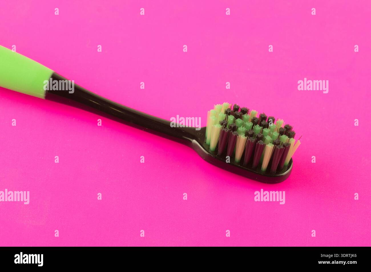 new modern toothbrush isolated on pink solid background Stock Photo - Alamy