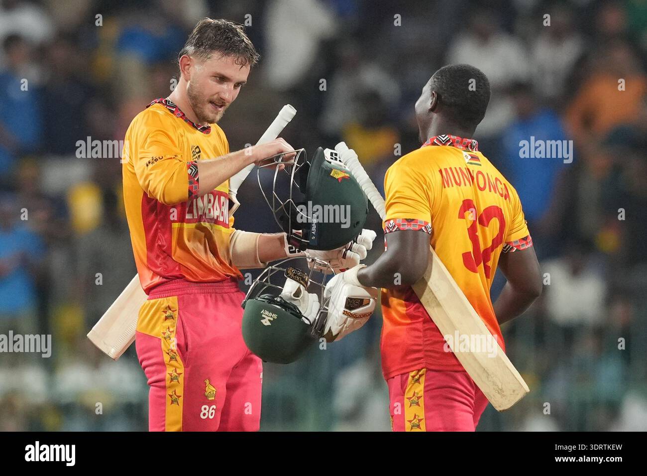 Zimbabwe's Tony Munyonga, right, and Brian Bennett celebrate after ...