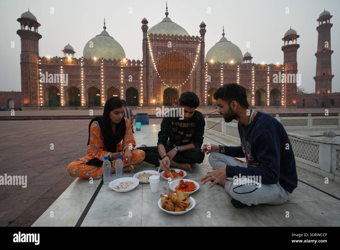 People break their fast during the Muslim holy fasting month of Ramadan ...