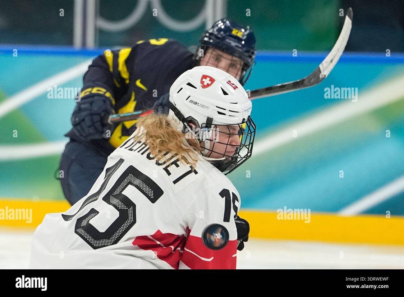 Switzerland's Laure Meriguet (15) grimaces during a women's ice hockey ...