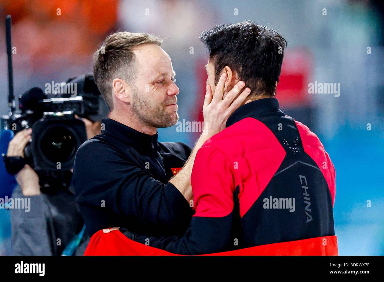 coach Johan de Wit celebrates with winner Zhongyan Ning of China after ...