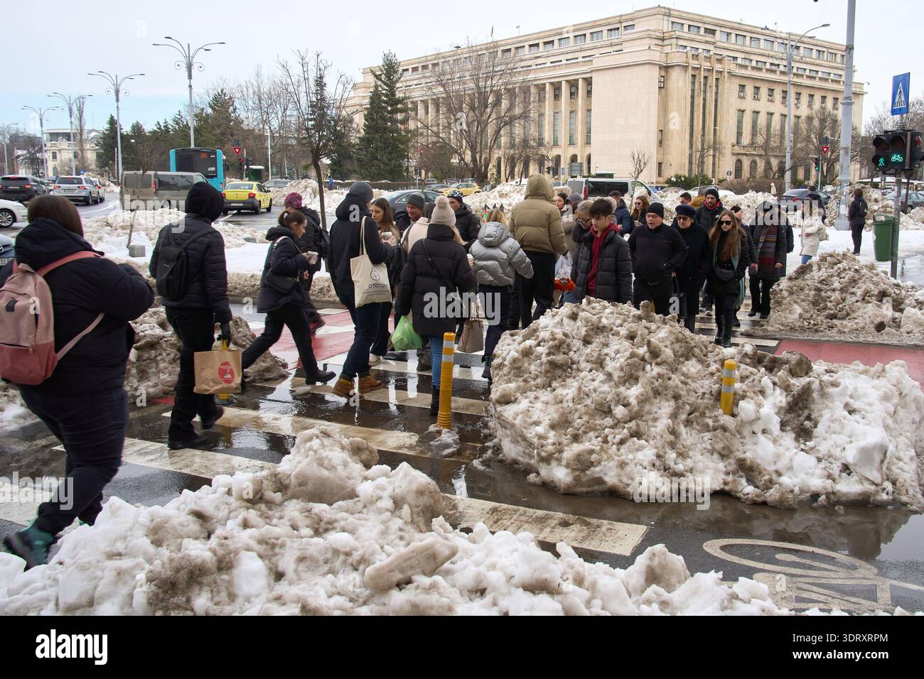 Bucharest, Romania. 19th Feb, 2026: People cross the street through ...