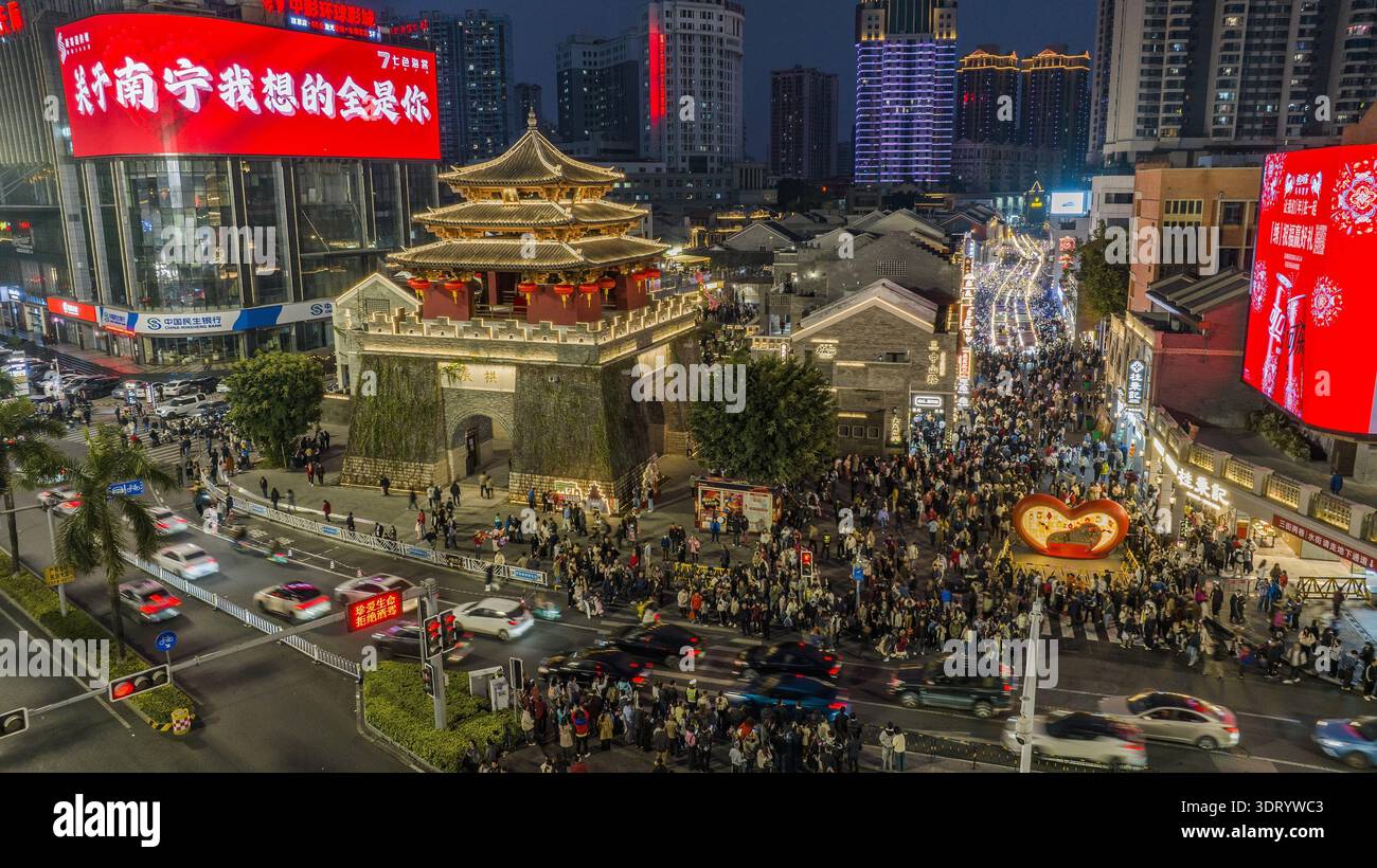 People tour Zhongshan Road, a shopping street, in Nanning in southern ...