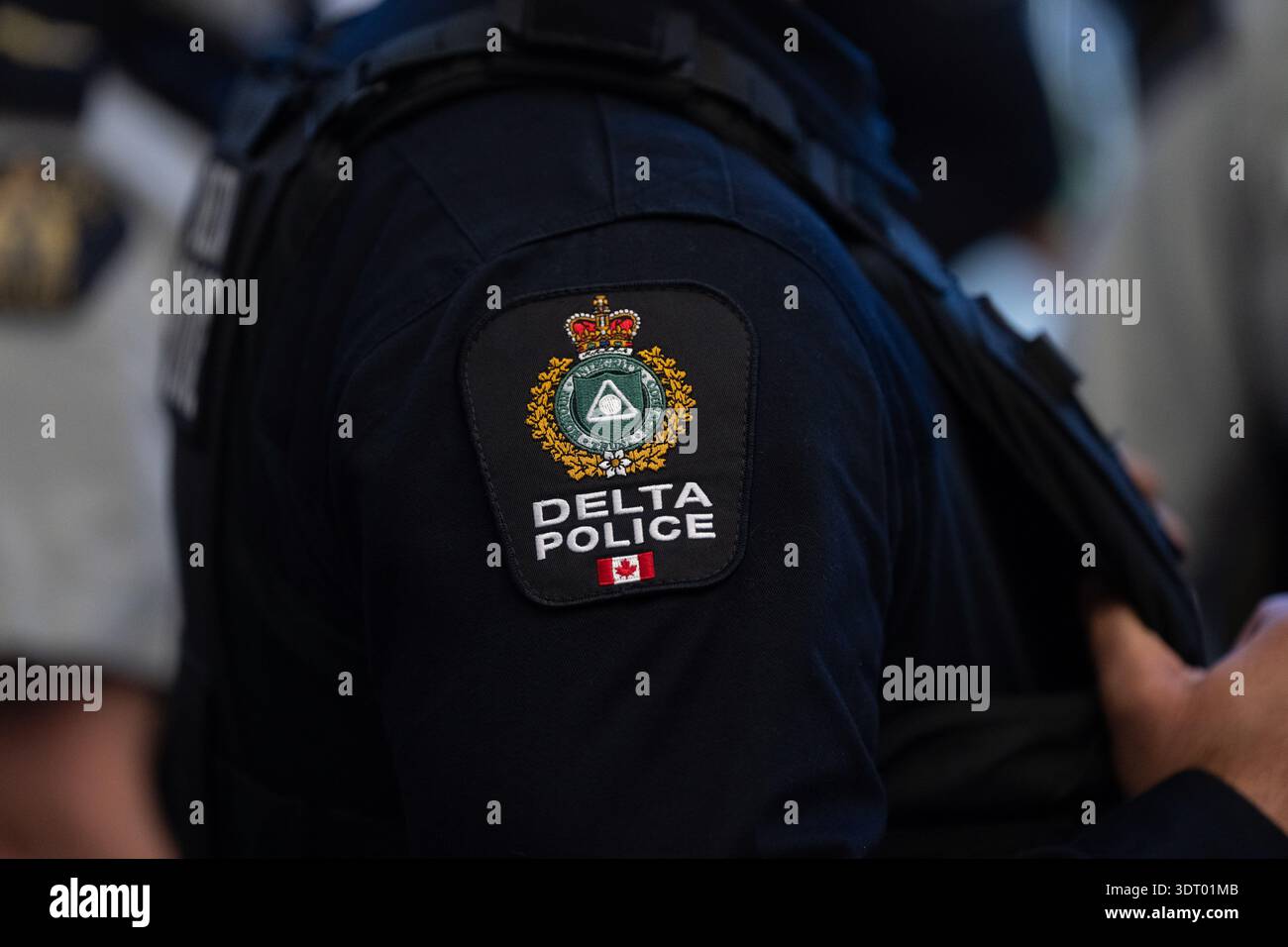 A Delta Police patch is worn by an officer at RCMP "E" Division ...