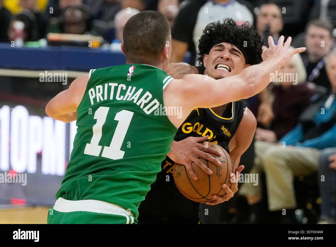 Golden State Warriors forward Gui Santos, right, drives to the basket ...