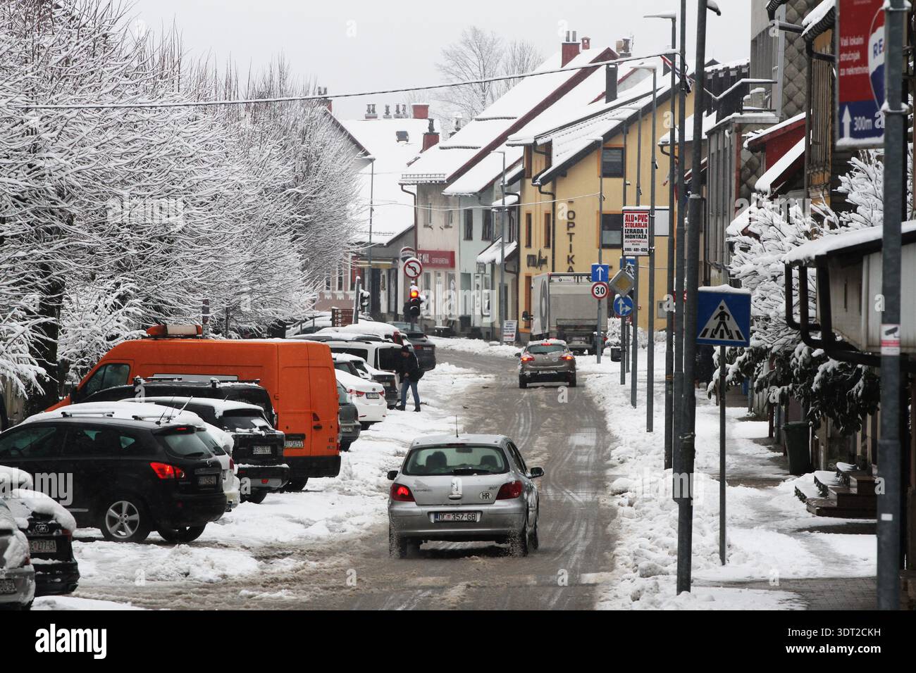 Snow-covered streets in the town center during ongoing snowfall on ...