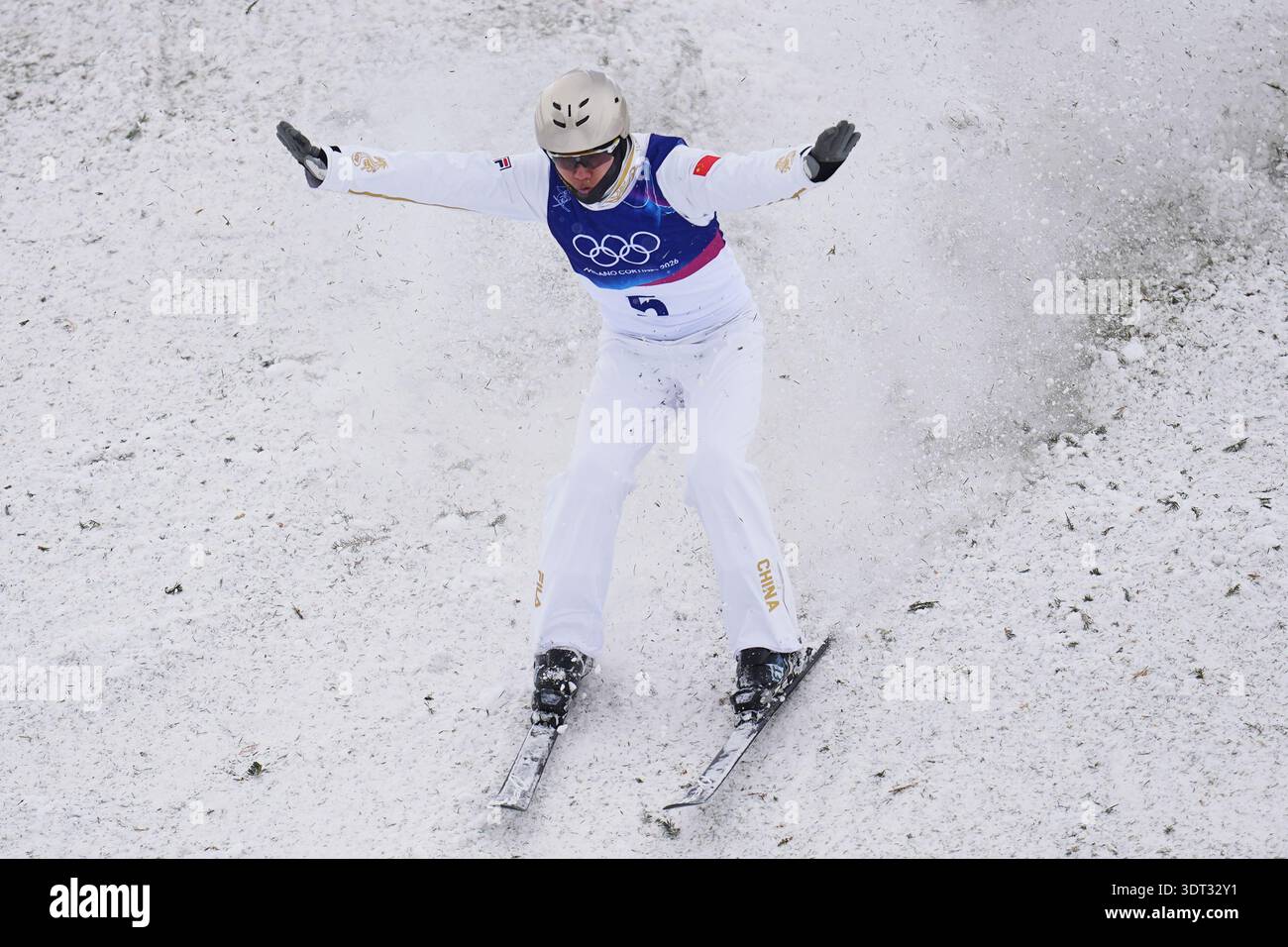 China's Wang Xindi lands during the men's freestyle skiing aerials ...