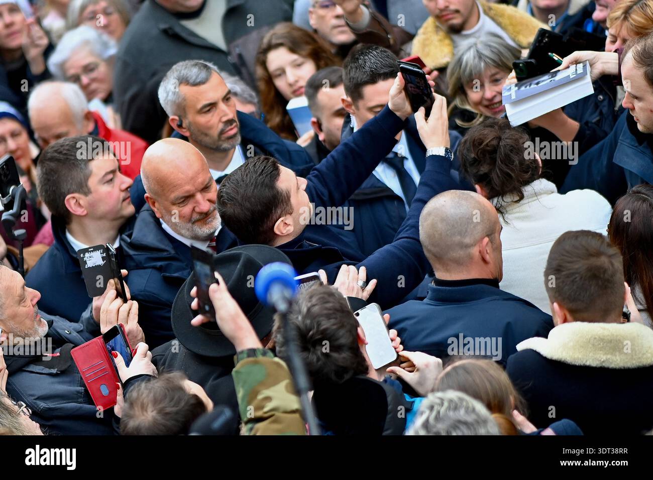 Rassemblement National President Jordan Bardella is surrounded by ...