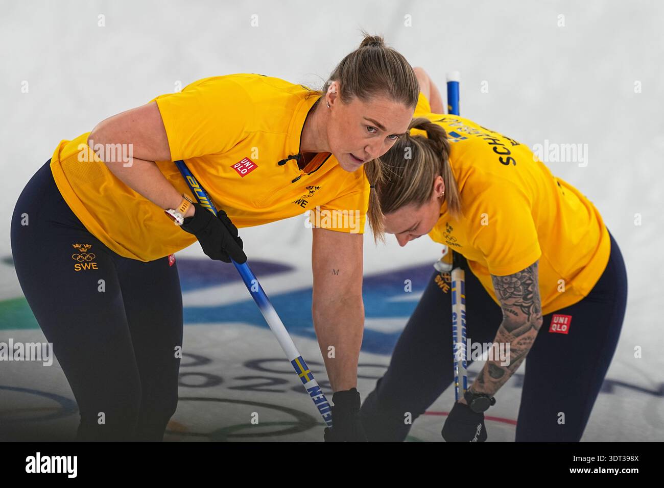 Sweden's Sara McManus, left, competes during a women's curling ...