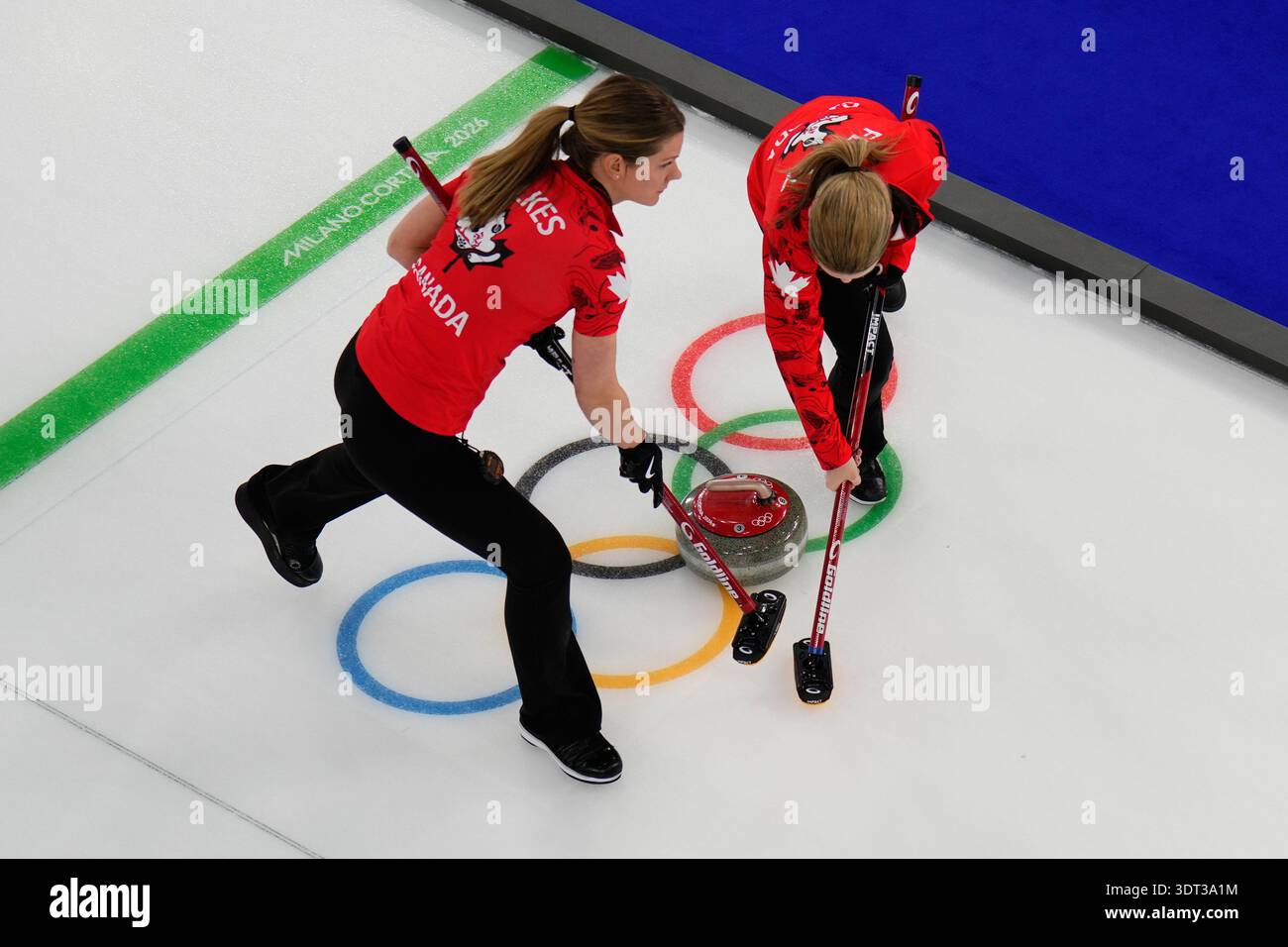 Sarah Wilkes of Canada, left, and Tracy Fleury of Canada compete ...