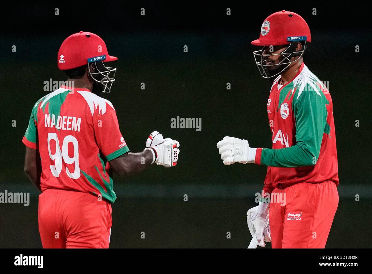 Oman's Mohammad Nadeem, left, and Wasim Ali celebrate during the T20 ...