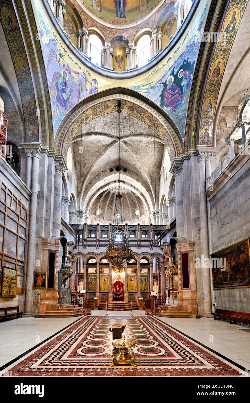 Visitors explore the interior of the Church of the Holy Sepulchre in ...