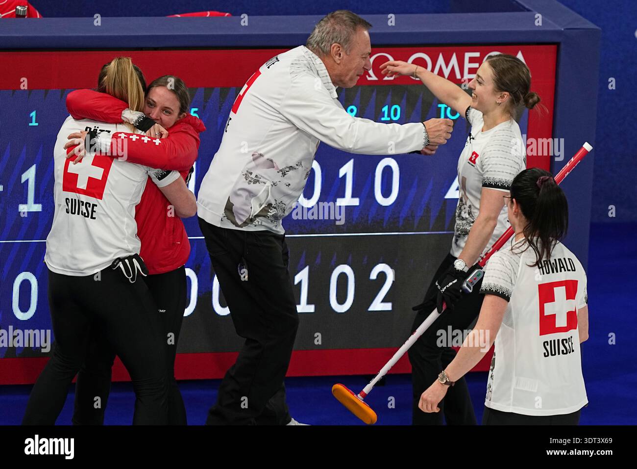 Team Switzerland celebrates winning a women's curling semifinal match ...