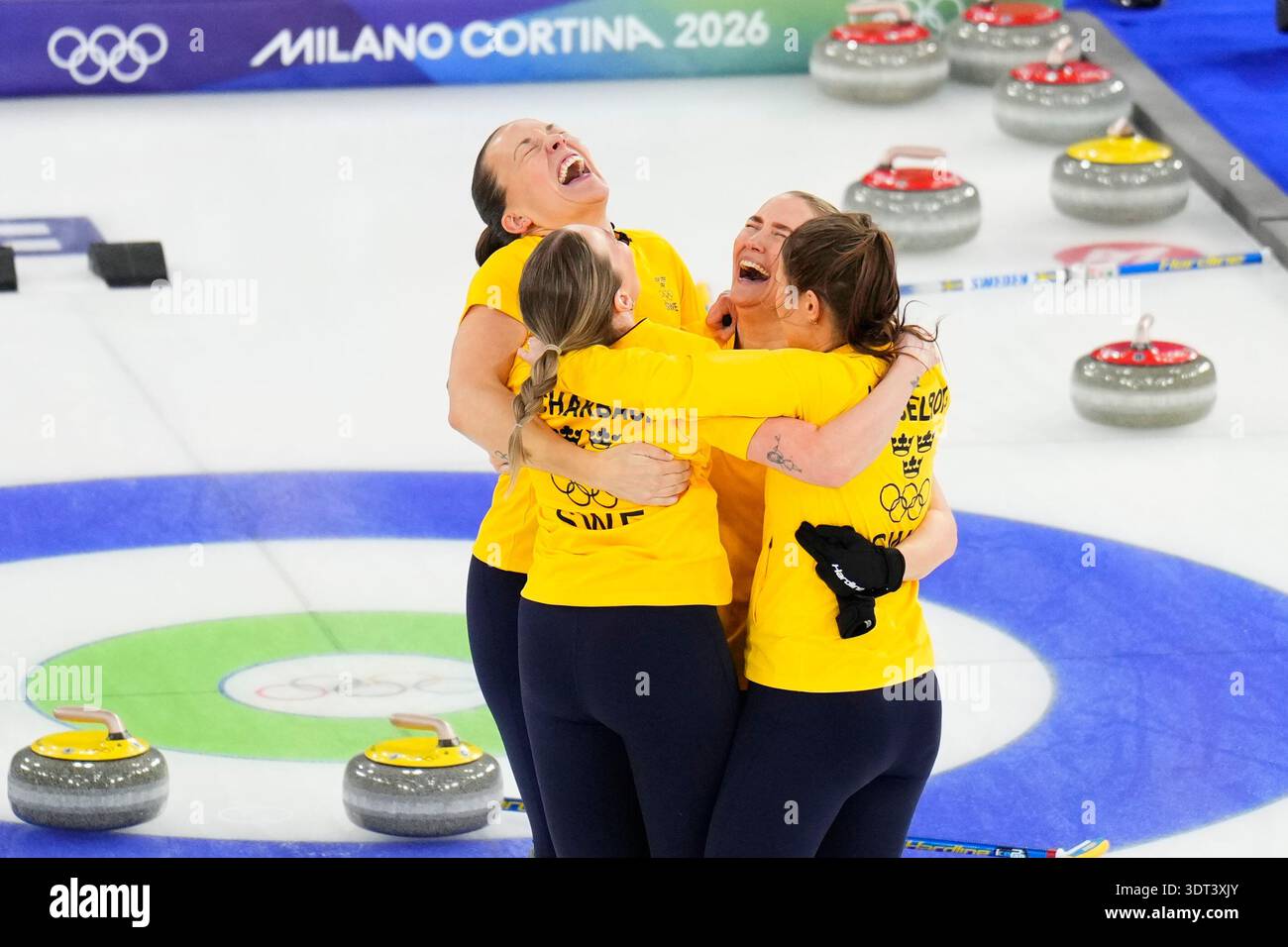 Team Sweden celebrates after defeating Canada during the curling women ...