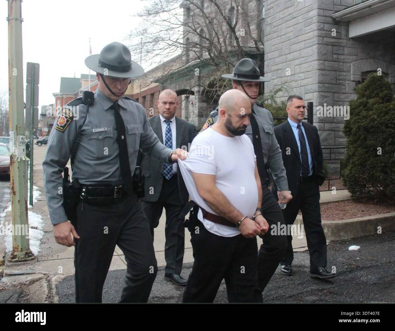 John Edward Kurtz, a former prison guard, is taken by state troopers to ...